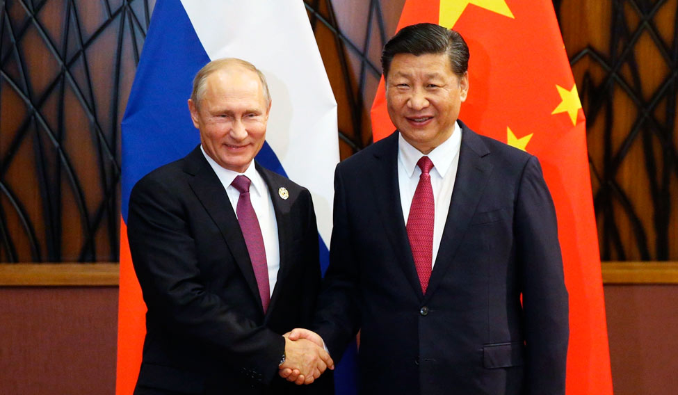 Xi, Putin pledge to enhance regional, international cooperation