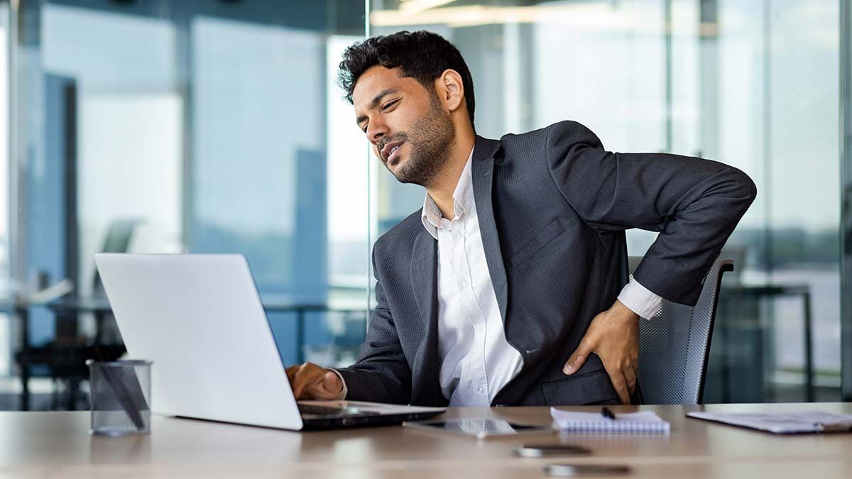 Sit less to ease back pain- The Week