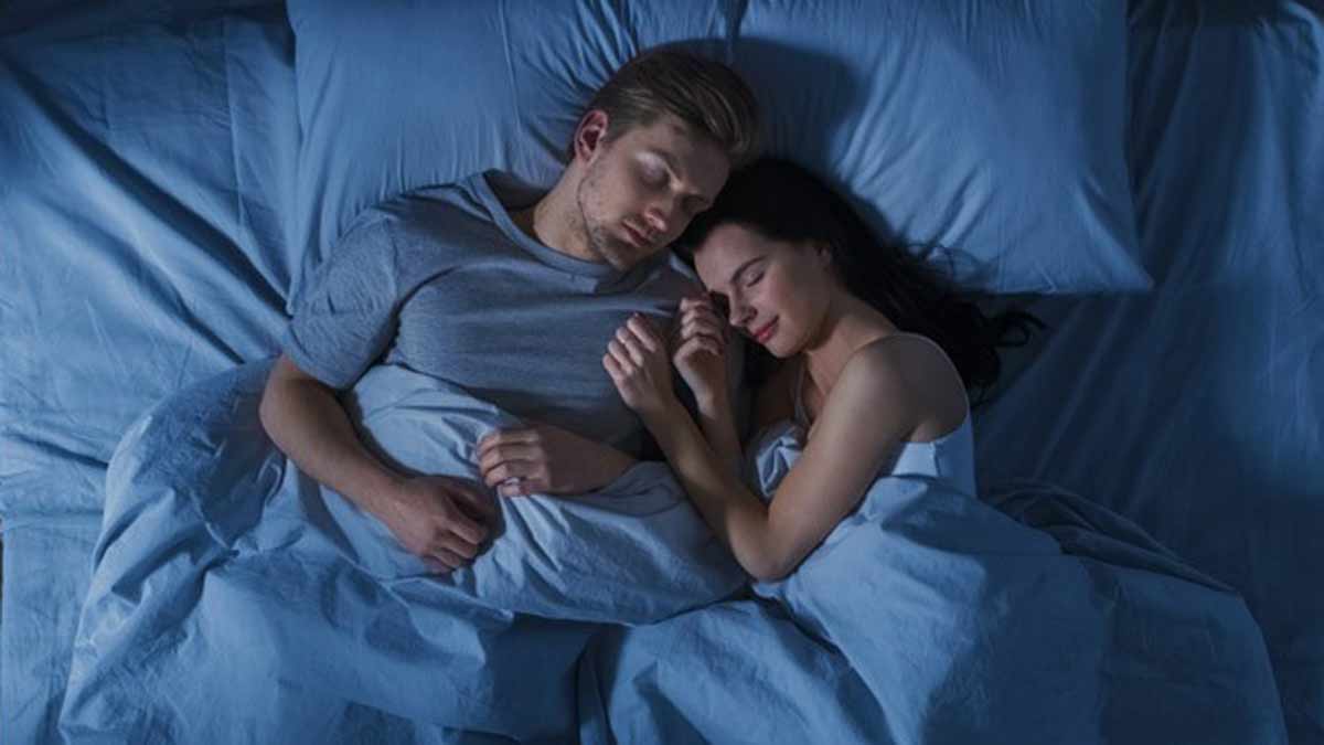 Snuggle up! Why sharing bed with partner will improve your sleep ...